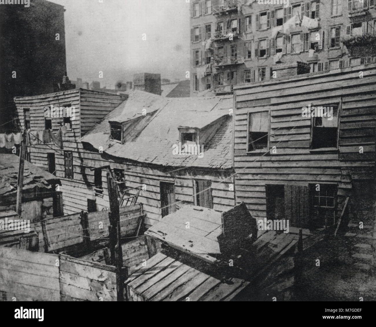 Jacob A. Riis, a pioneering photographer, captures the harsh living ...