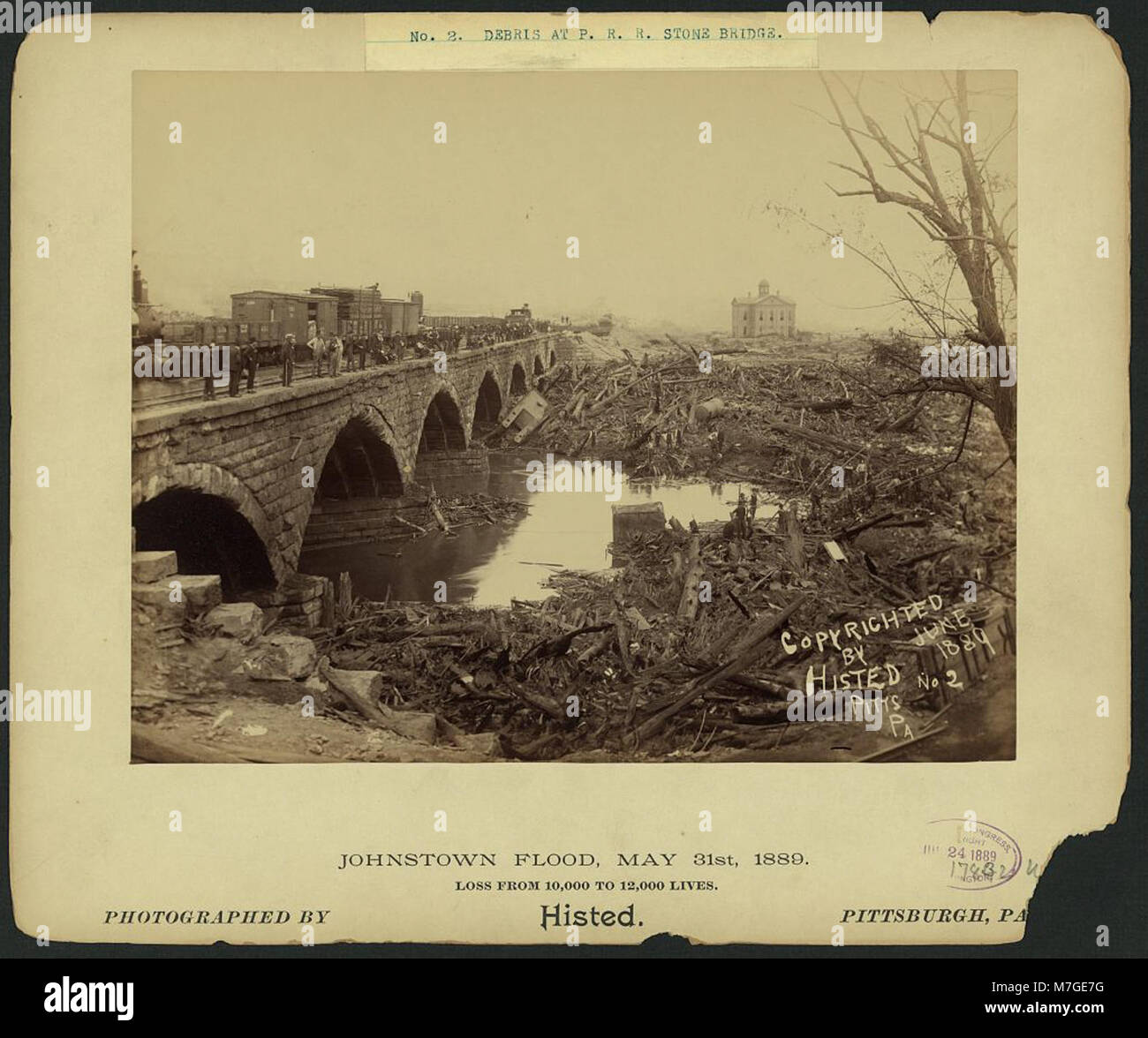 A photograph depicting the aftermath of the Johnstown Flood, showing ...