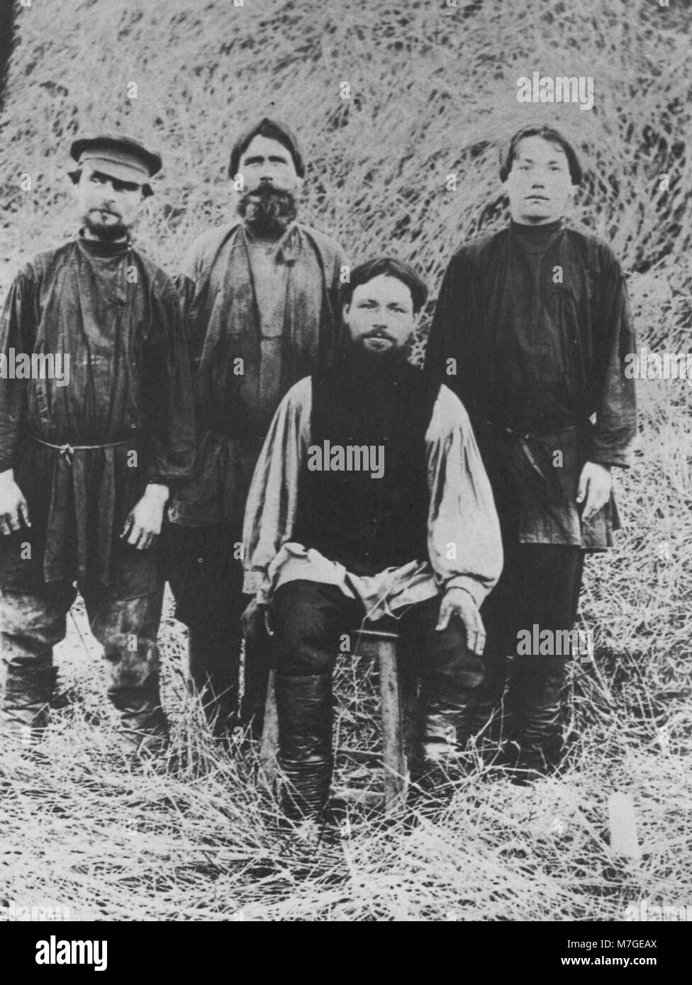 A Russian photograph from around 1880, depicting a farmer with his son ...