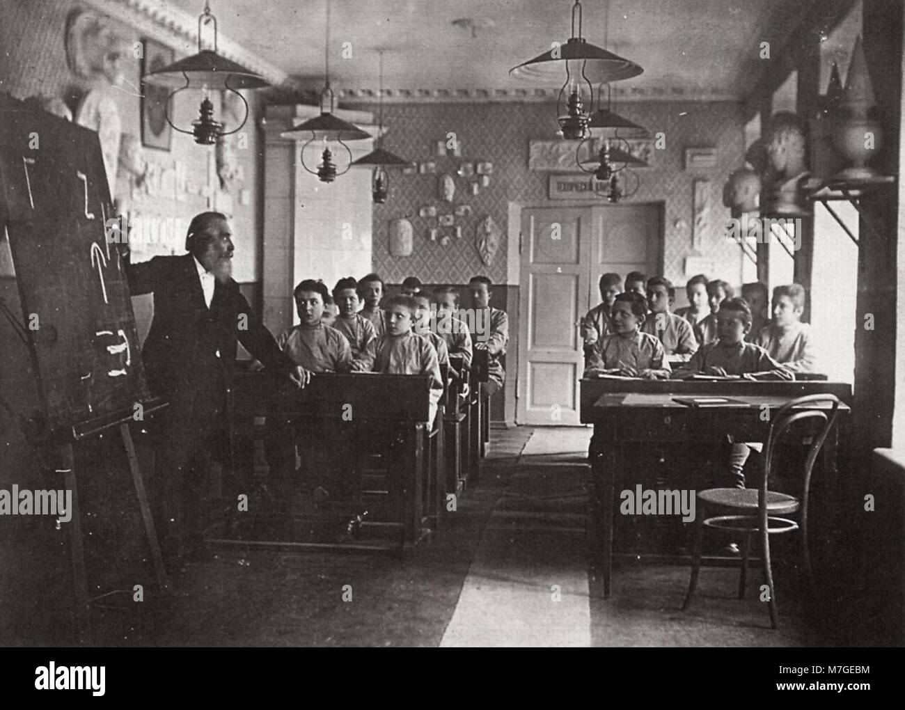 A Russian photograph from 1890-1900 depicting a lesson in a printing ...