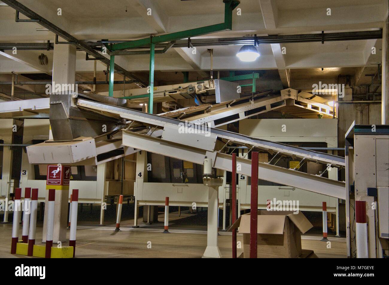 Interior of a tobacco factory showing conveyors and silos Stock Photo ...
