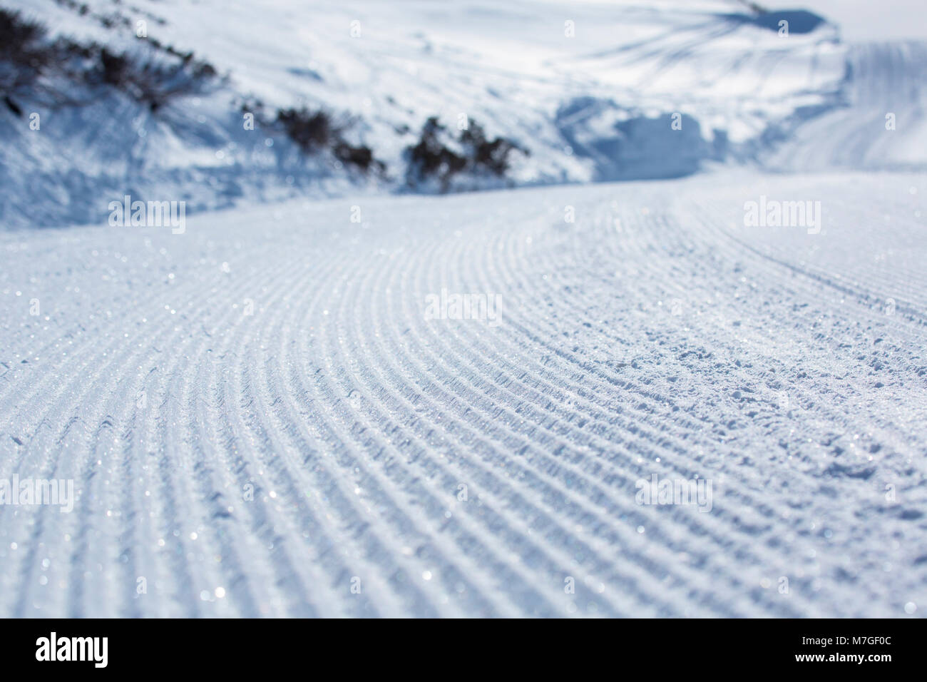 Snow path ski track surface, corduroy texture, selective focus ...