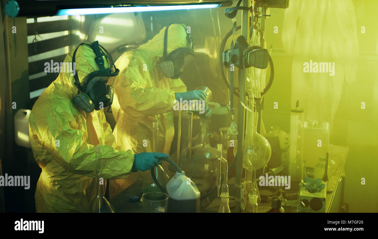 In the Underground Laboratory Two Clandestine Chemists Wearing ...