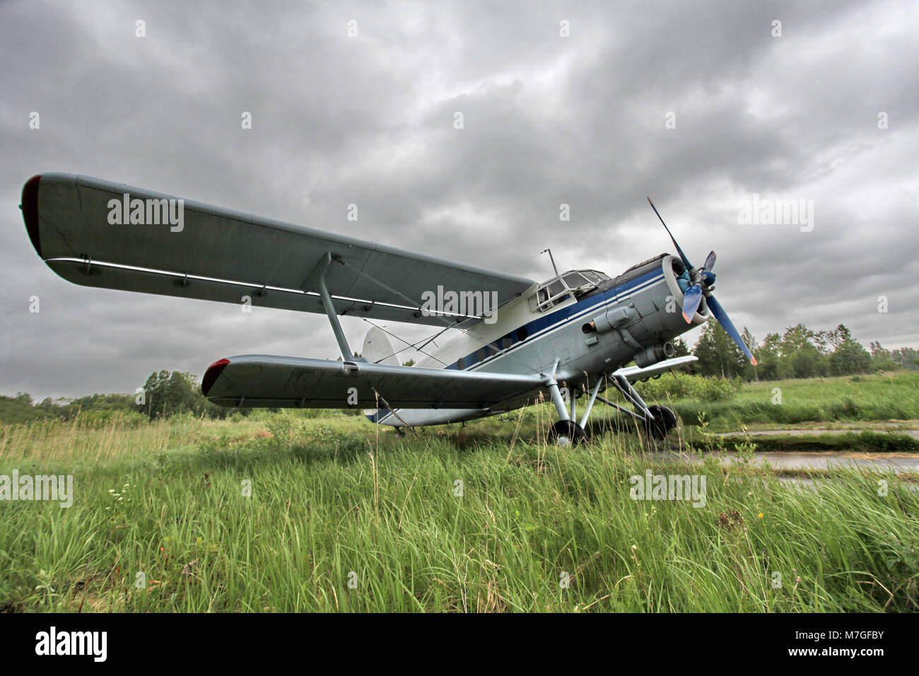 Biplane on the airfield side view Stock Photo - Alamy