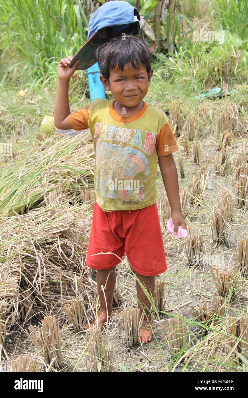 cute little boy with a cap in his hand Stock Photo - Alamy