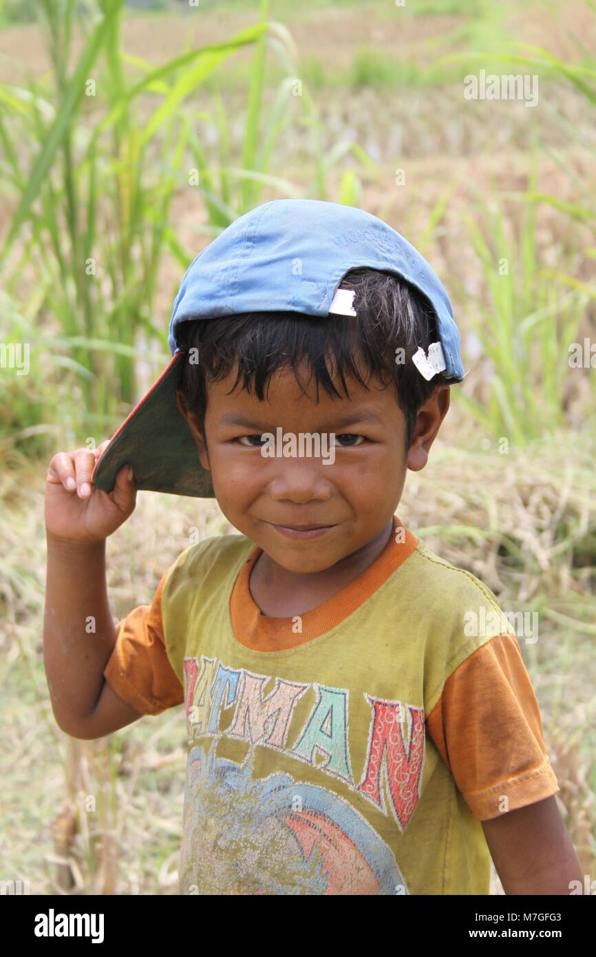 cute little boy with a cap in his hand Stock Photo - Alamy
