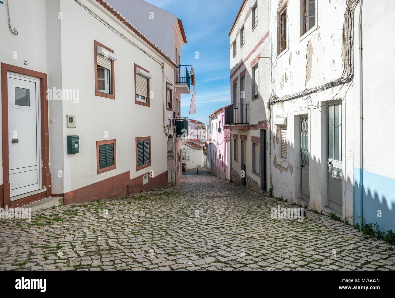 traditional narrow cobbled street in Nazare, Portugal Stock Photo - Alamy