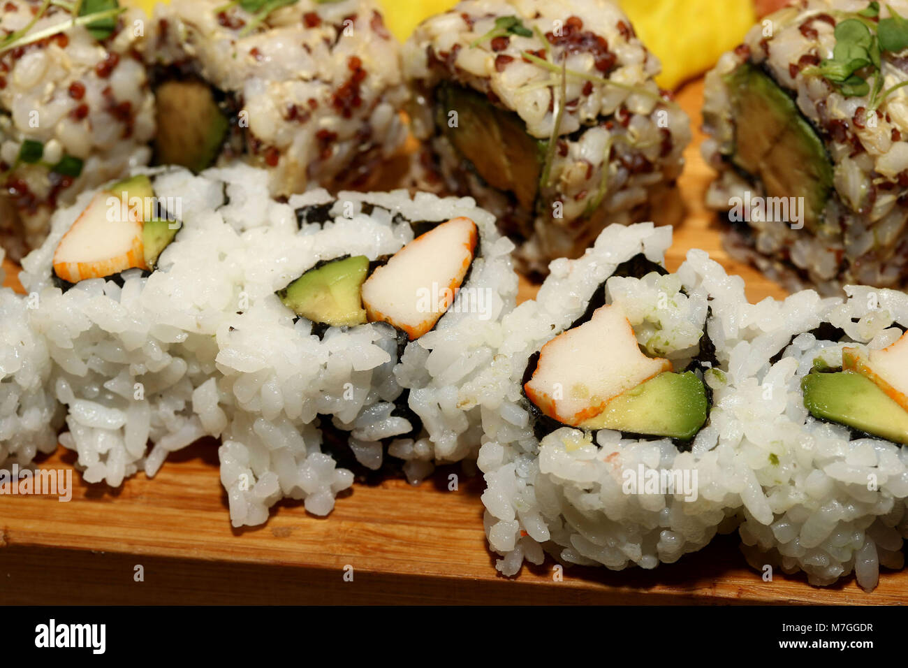 Avocado and crab sushi rolls Stock Photo - Alamy