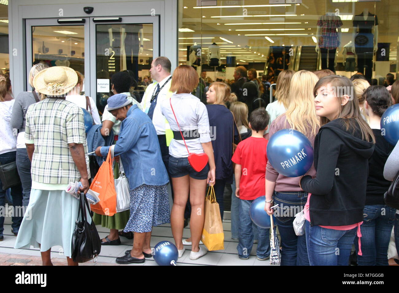 Shoppers queuing outside store High Resolution Stock Photography and ... Shoppers queuing outside store High Resolution Stock Photography and ...