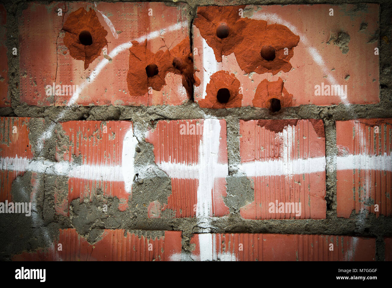 Wall with bullet damage Stock Photo - Alamy