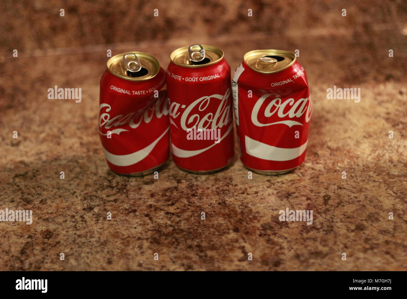 Crumpled Coca Cola can. Coca Cola drinks are produced and manufactured ...