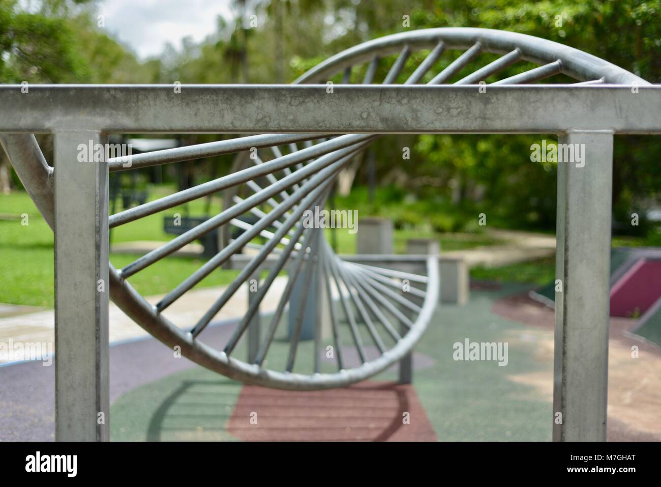 Childrens playground area with abstract turning rotating monkey bars ...