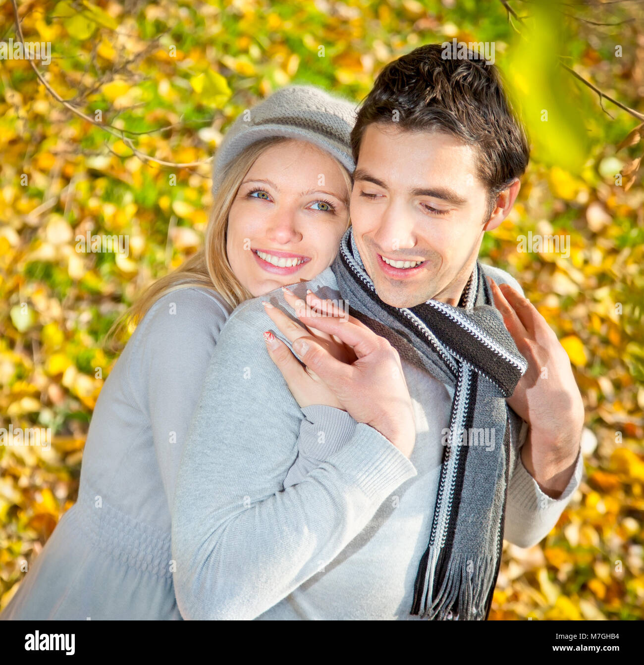 Happy couple have a romance in fall branches of wood Stock Photo - Alamy