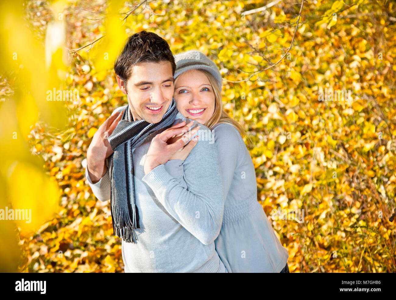 Happy couple have a romance in fall branches of wood Stock Photo - Alamy