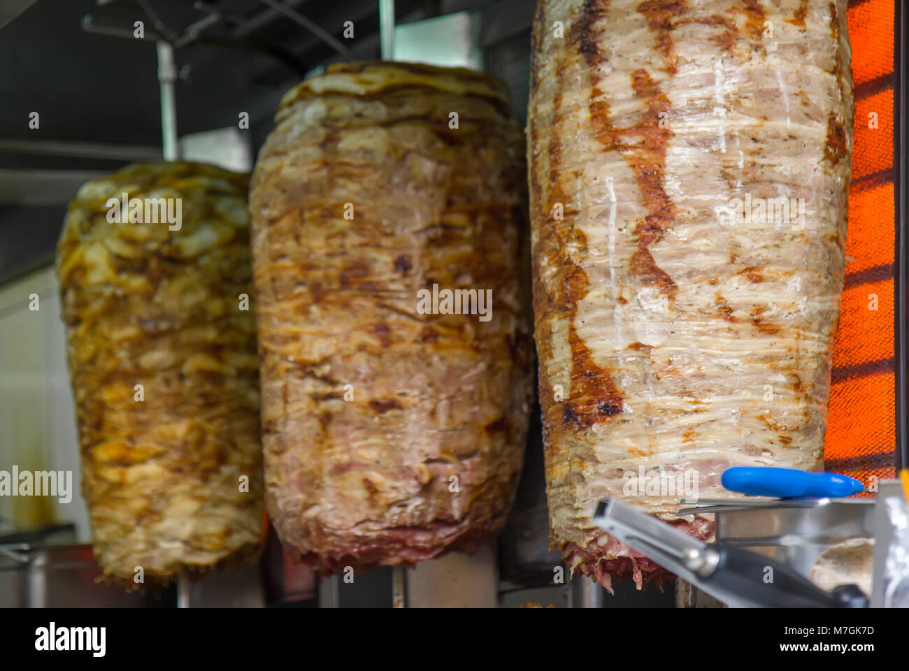 Traditional Greece gyros on the rotating fireplace Stock Photo - Alamy