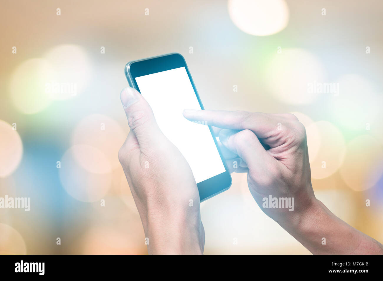 One using smartphone and the screen shining bright light. Colorful de ...