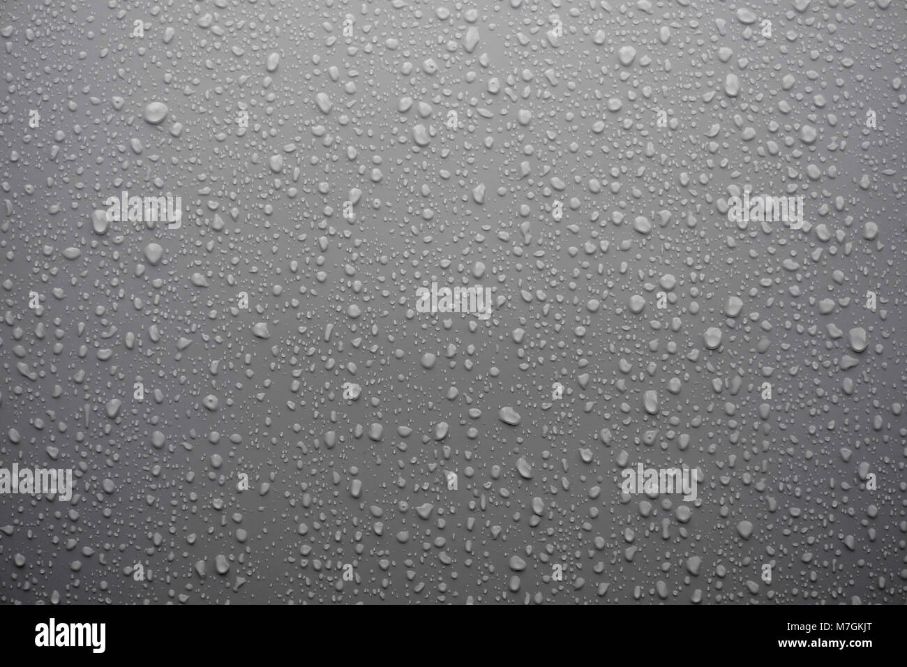 water drop on gray surface as background Stock Photo - Alamy