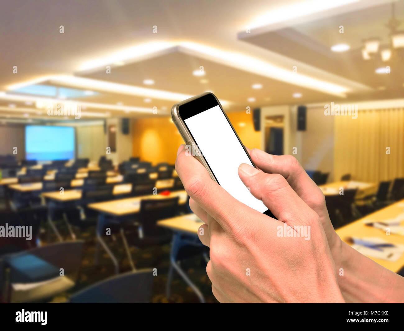 Hands using smartphone in conference meeting room Stock Photo - Alamy
