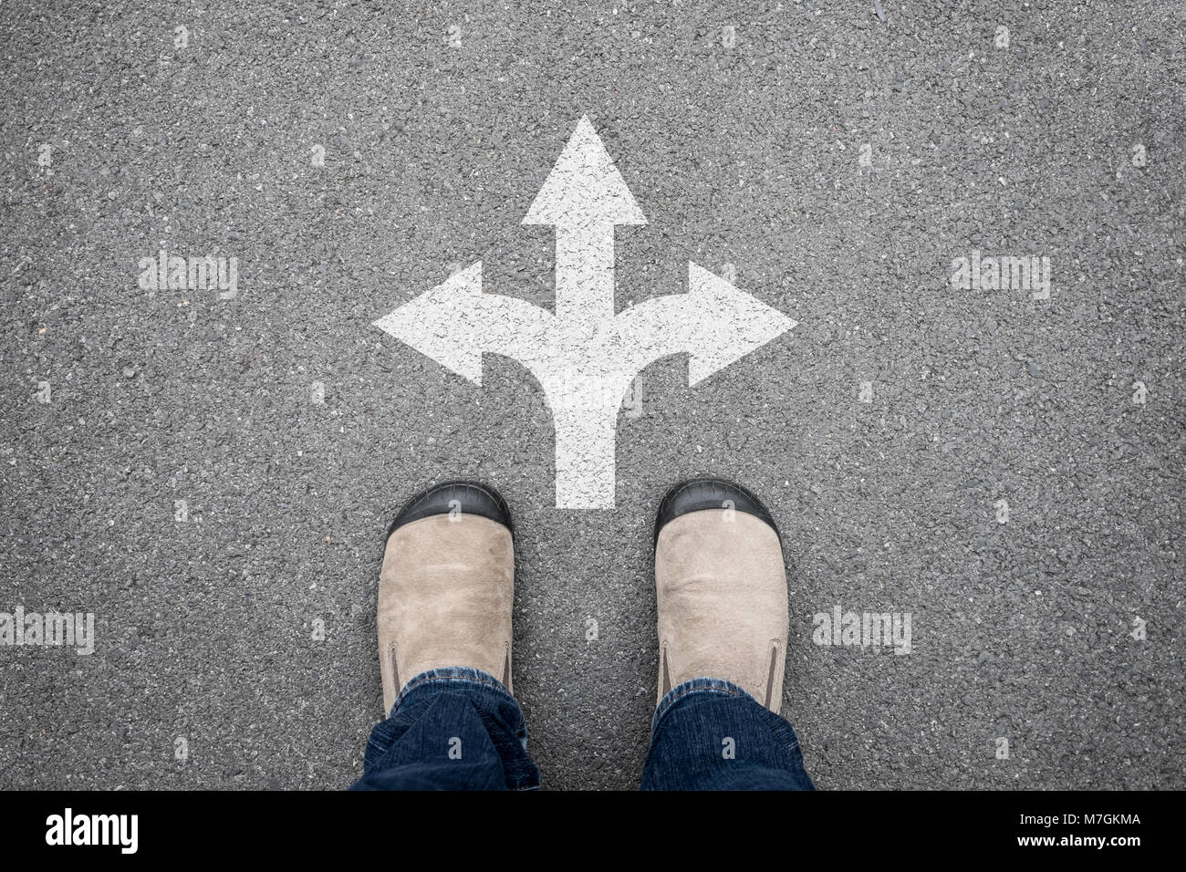 Brown shoes standing at the cross road making decision which way to go ...