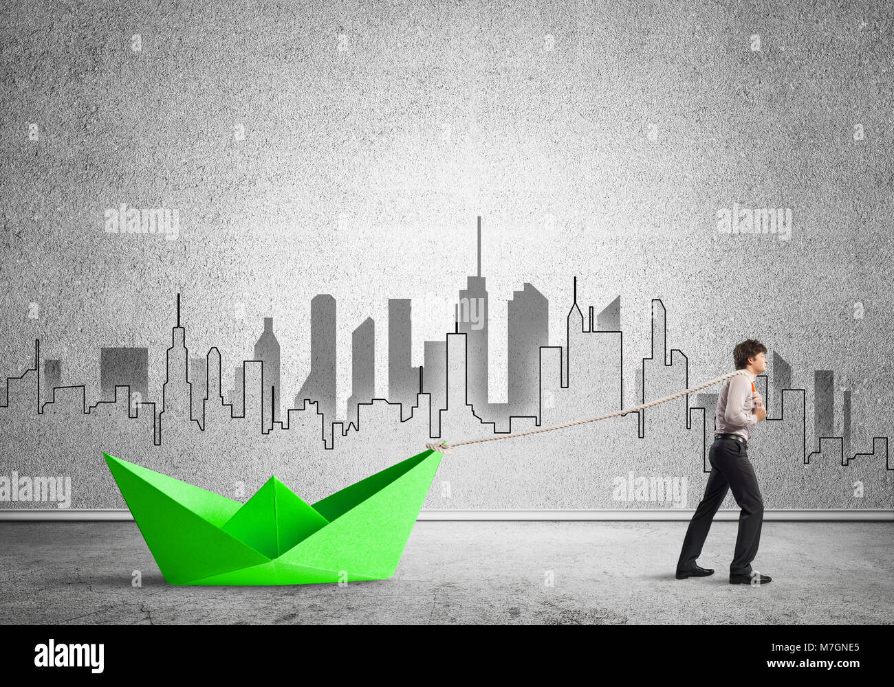 Successful businessman pulling with rope paper boat Stock Photo - Alamy