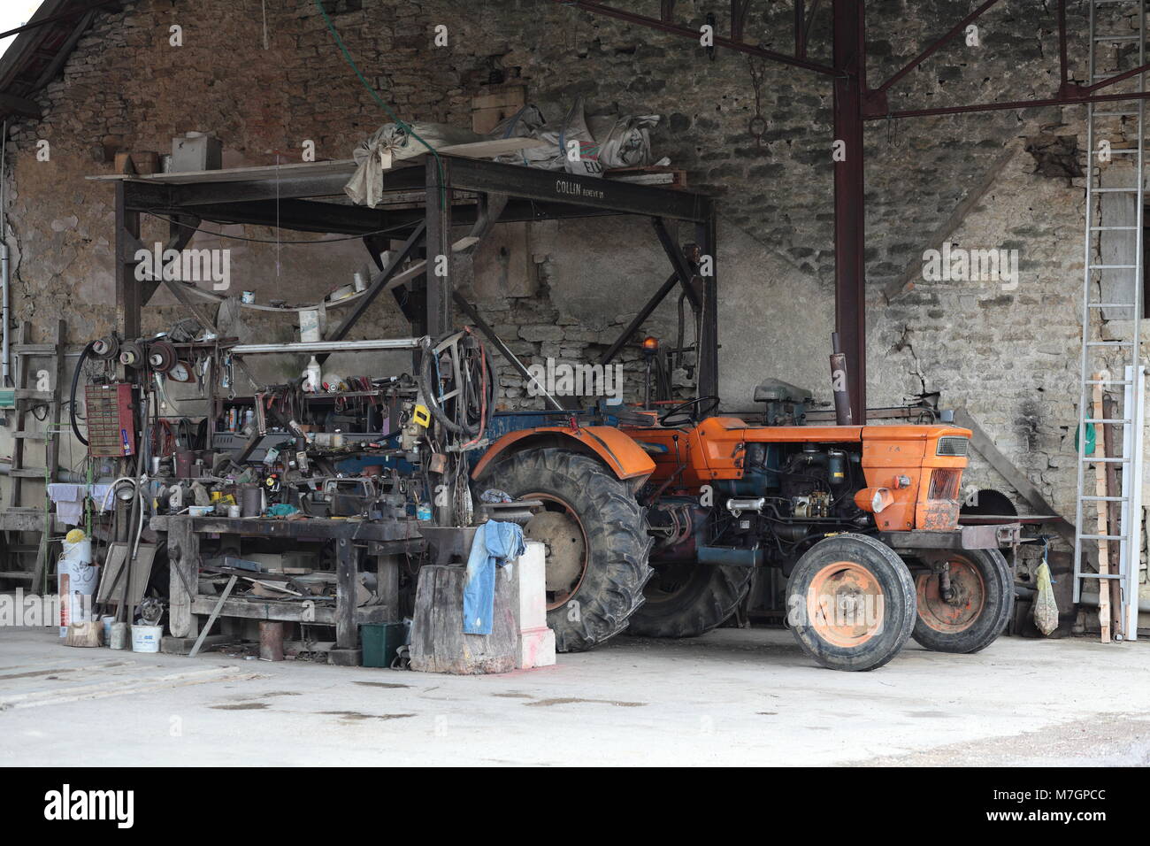 Old tractor in barn Stock Photo - Alamy