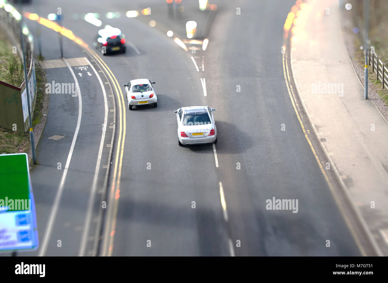 Tilt shift perspective of three cars Stock Photo - Alamy