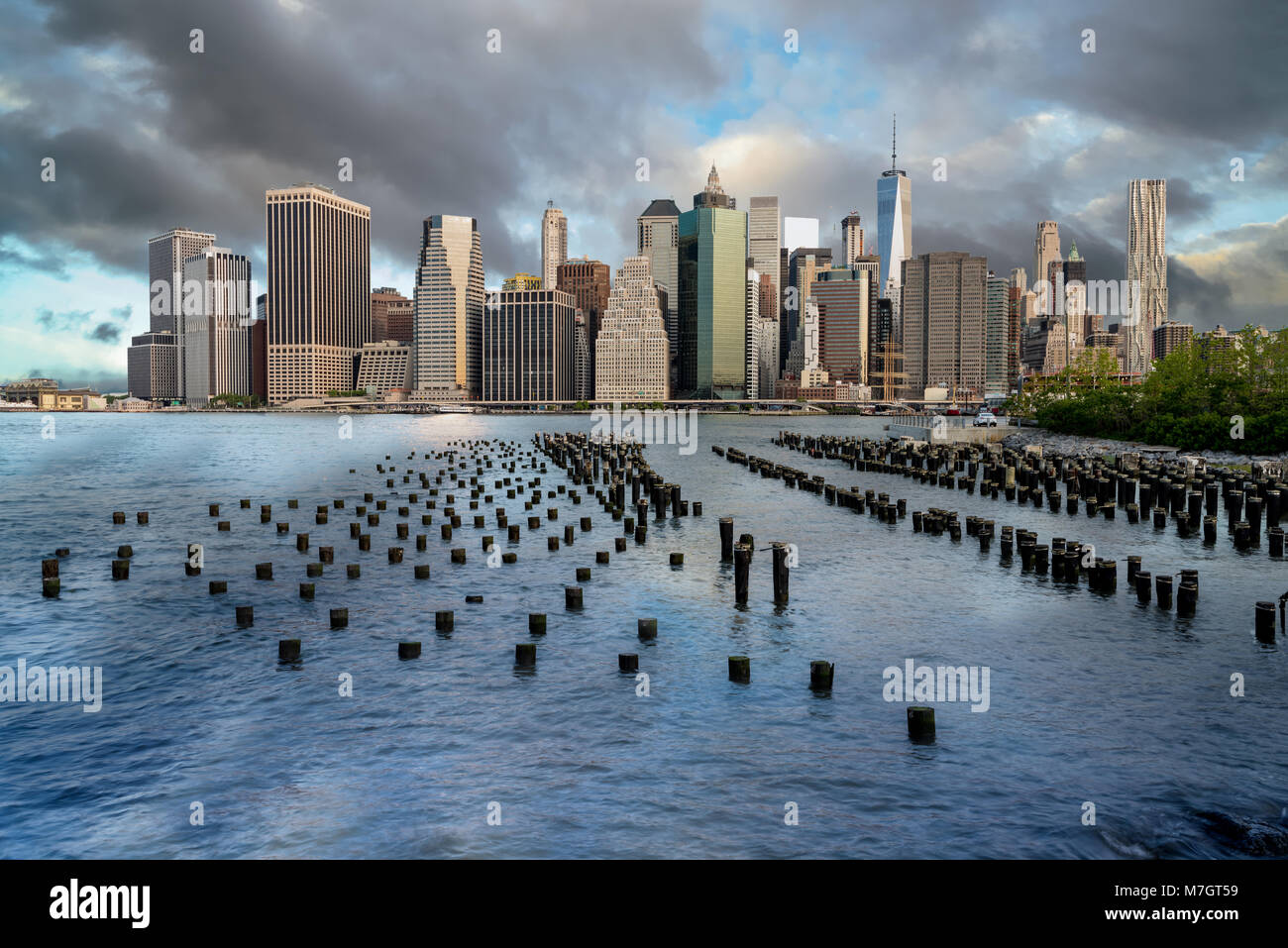Pylons from and old dock before the magnificent skyline of New York ...