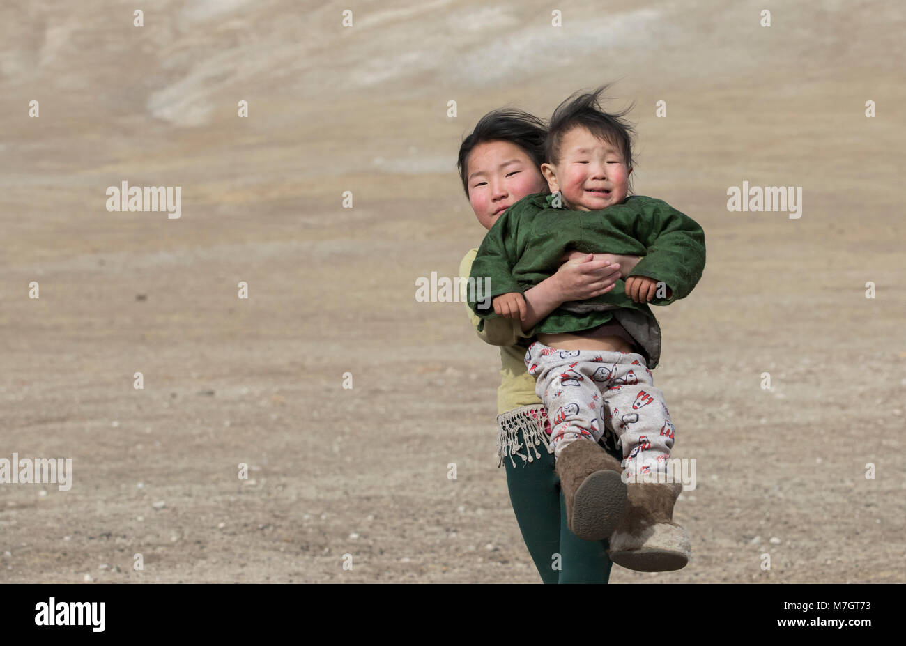 Hatgal, Mongolia, 3rd March 2018: mongolian kids in a steppe of ...