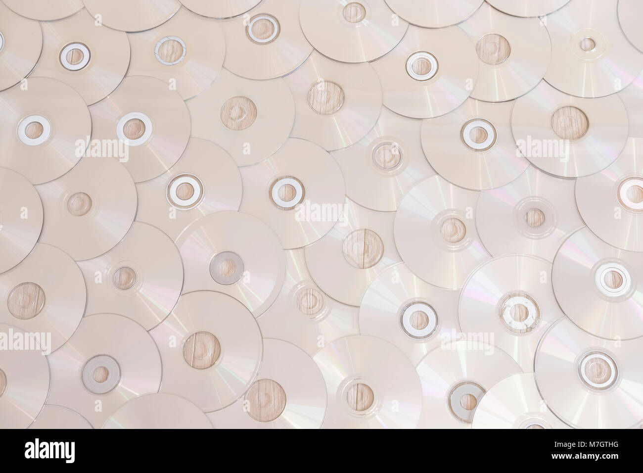 CDs collection many lots shinny looking down background retro digital ...