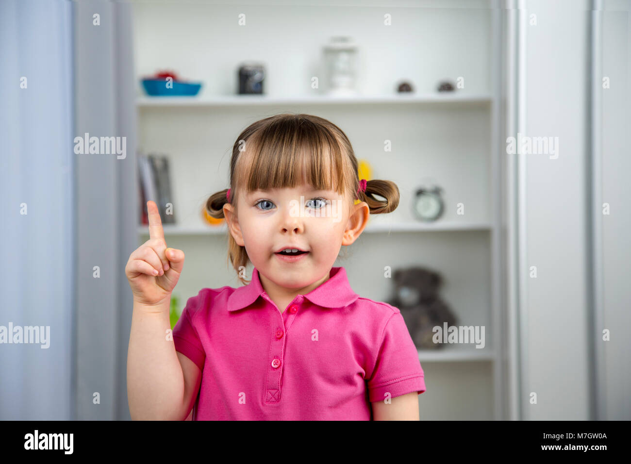 Cute little girl having a good idea. Child genius Stock Photo - Alamy