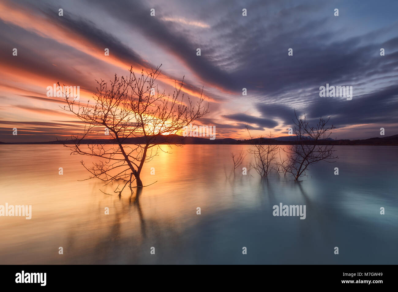 Quiet sunset at the lake, nobody there Stock Photo - Alamy