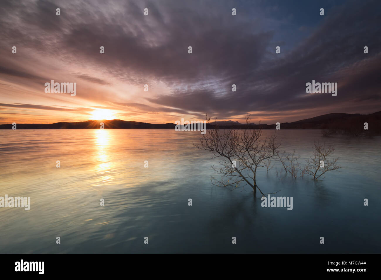 Quiet sunset at the lake, nobody there Stock Photo - Alamy