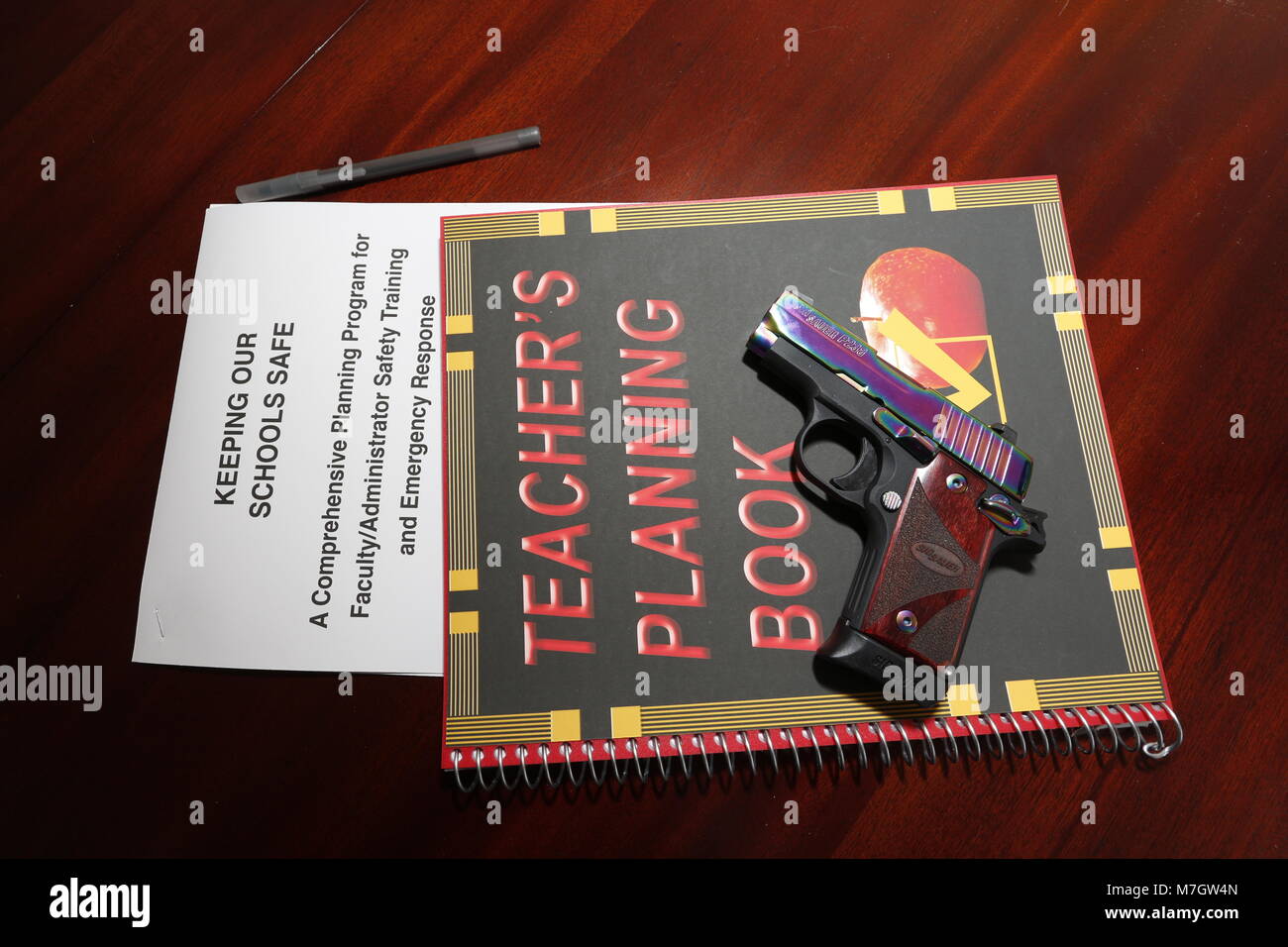 A teacher prepares her materials, including a handgun, to enter the ...