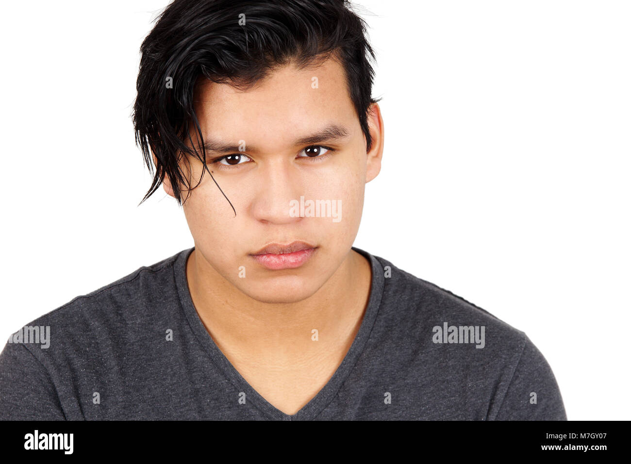 Latino teen boy serious hi-res stock photography and images - Alamy