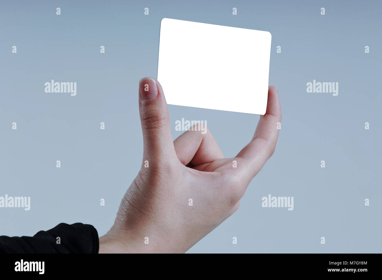 Female Hand Holding Isolated Card with Two Fingers Close Up Stock Photo ...