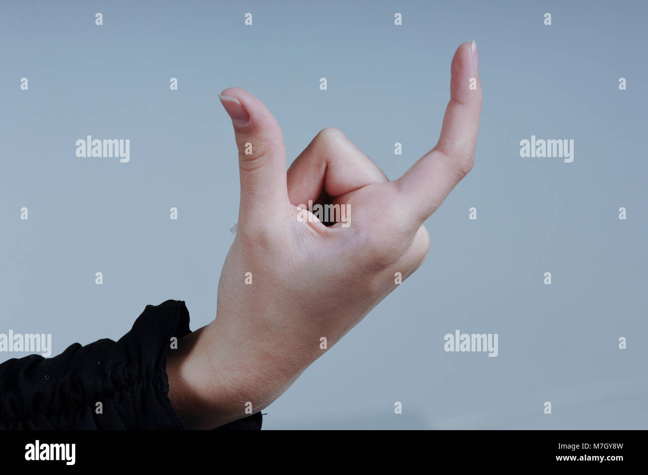 Female Hand Holding Isolated Card with Two Fingers Close Up Stock Photo ...