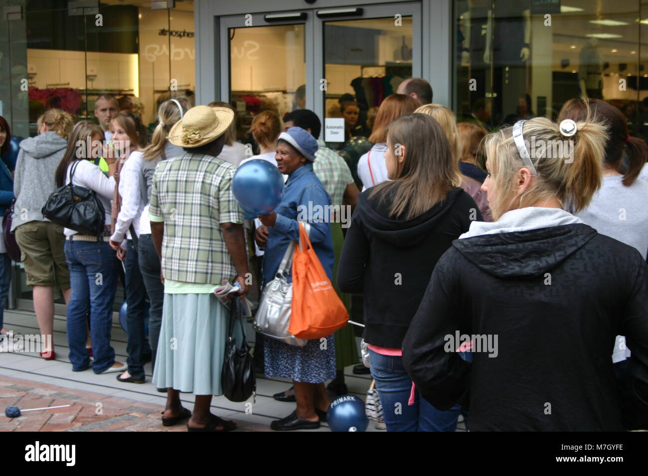Shoppers queuing outside store hi-res stock photography and images - Alamy