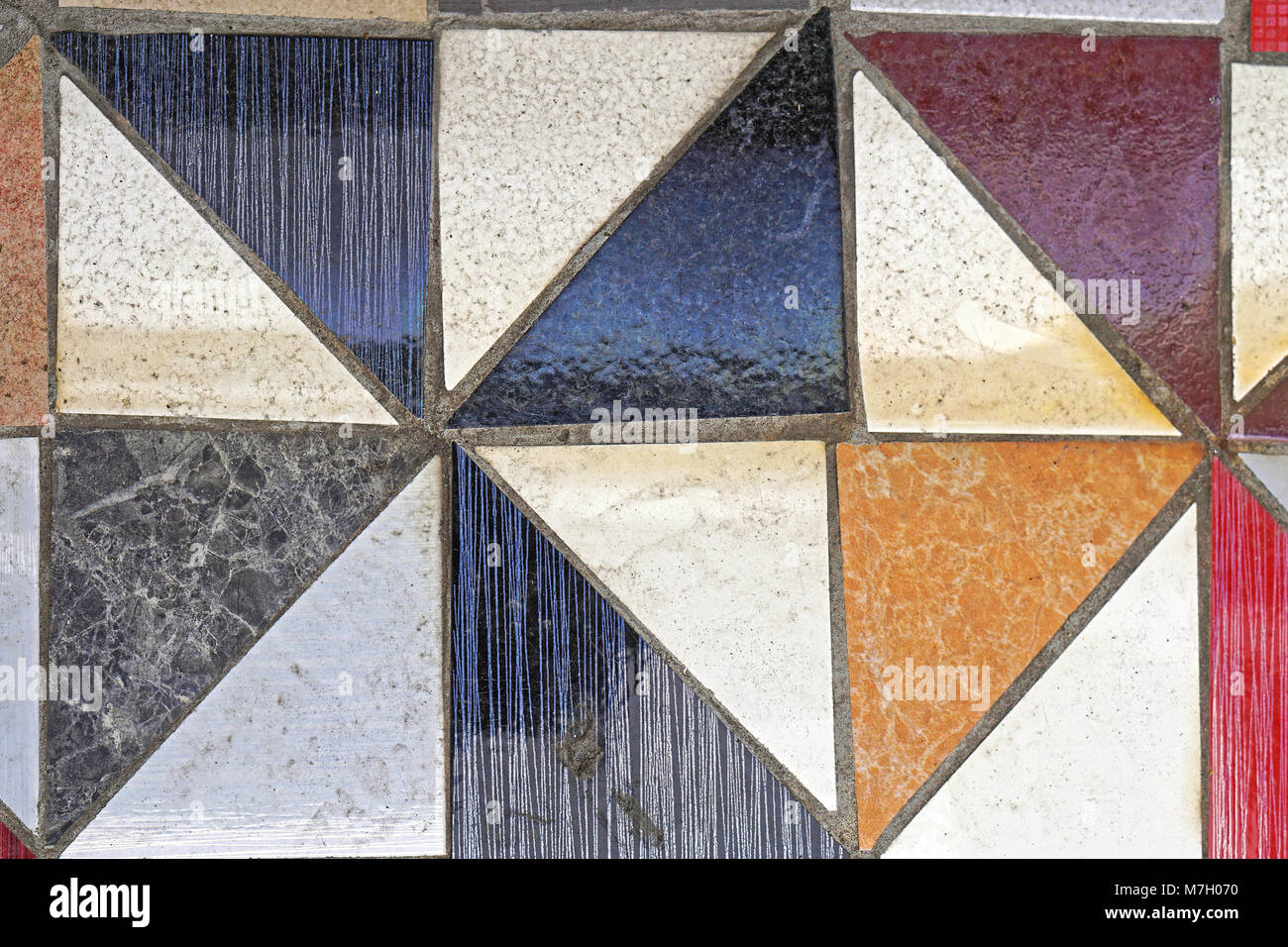 Grunge floor tiles made from triangular pieces Stock Photo - Alamy