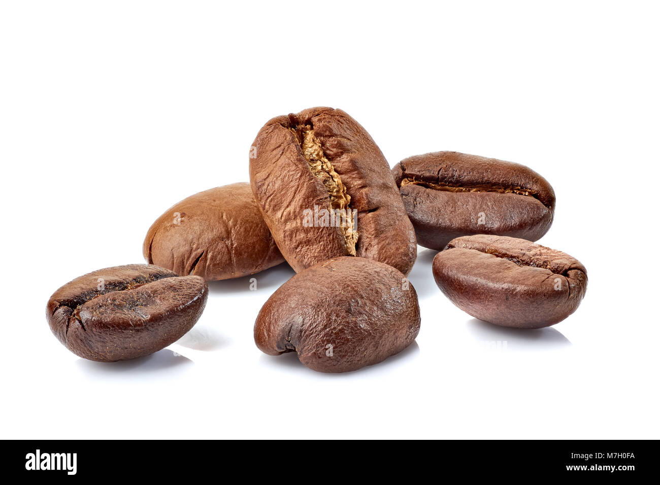 Some fresh roasted coffee beans on white Stock Photo - Alamy