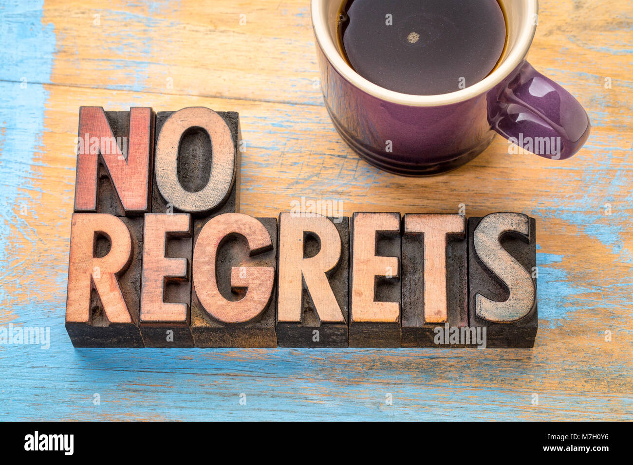 no regrets - word abstract in vintage letterpress printing blocks with ...