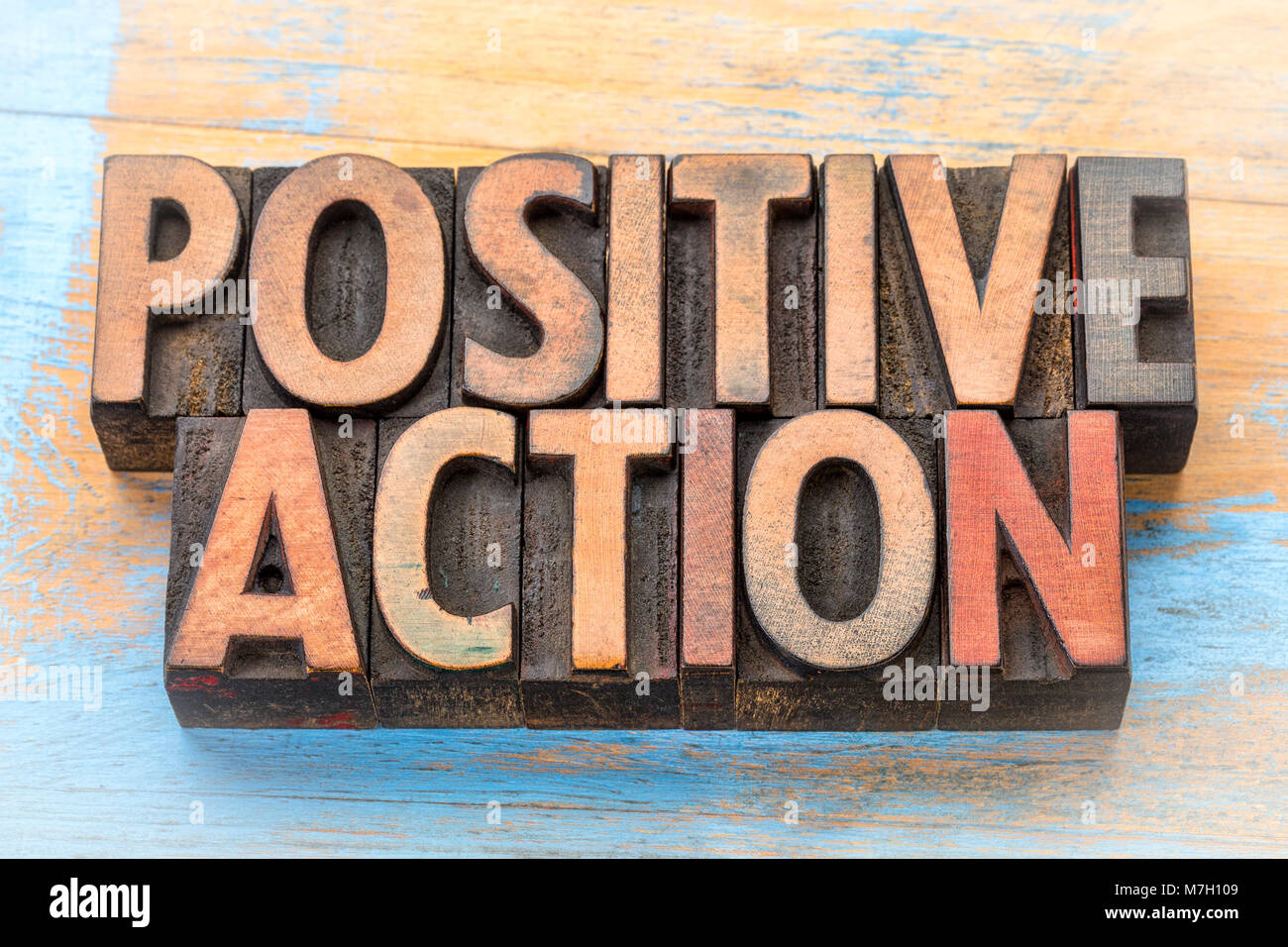 positive action - word abstract in vintage letterpress printing blocks ...