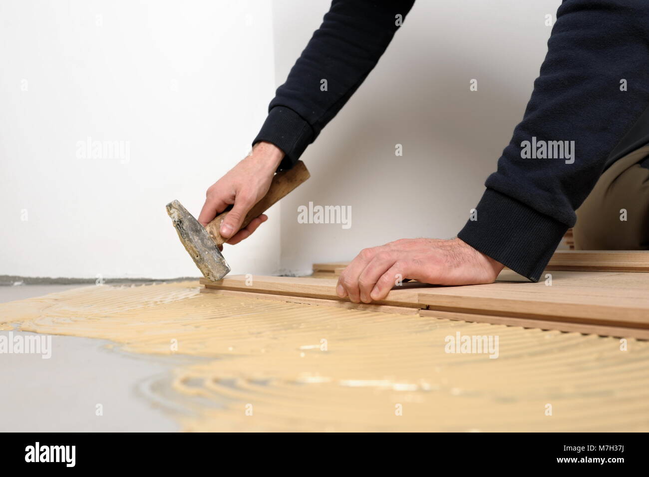 Construction in a renovated room installation of parquet Stock Photo ...