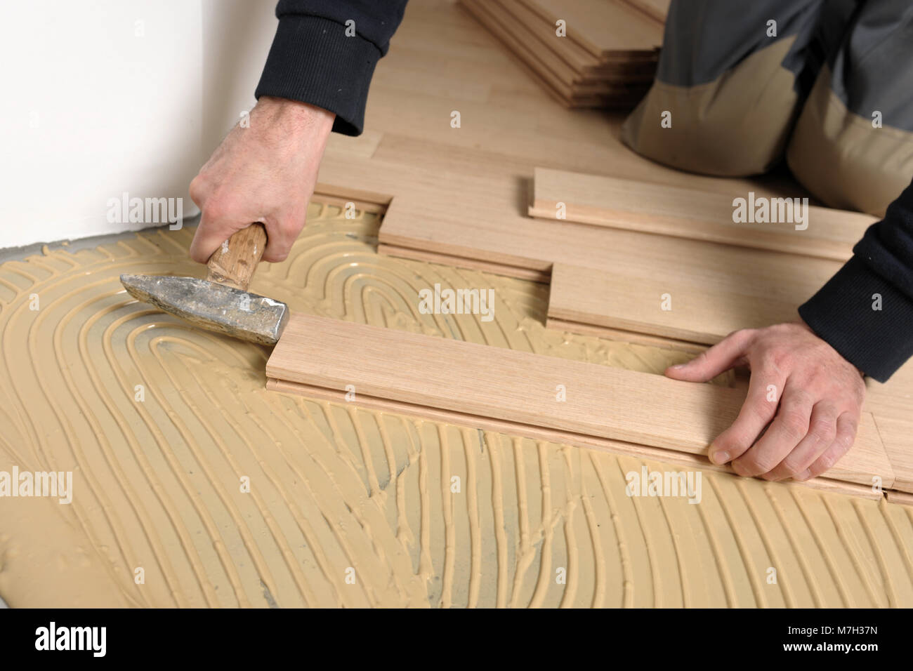Construction in a renovated room installation of parquet Stock Photo ...