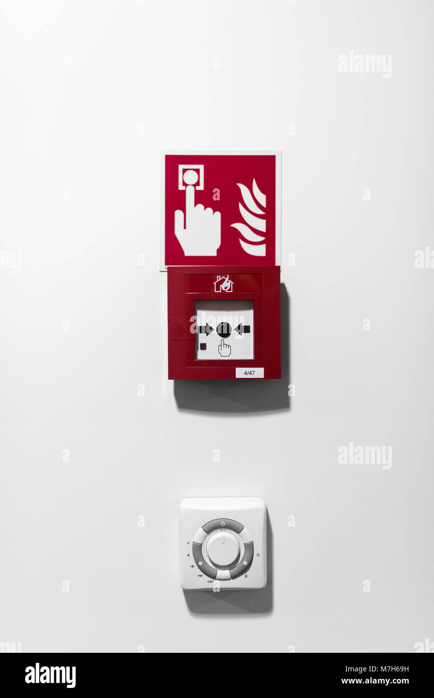 Red Fire alarm button on white wall Stock Photo - Alamy