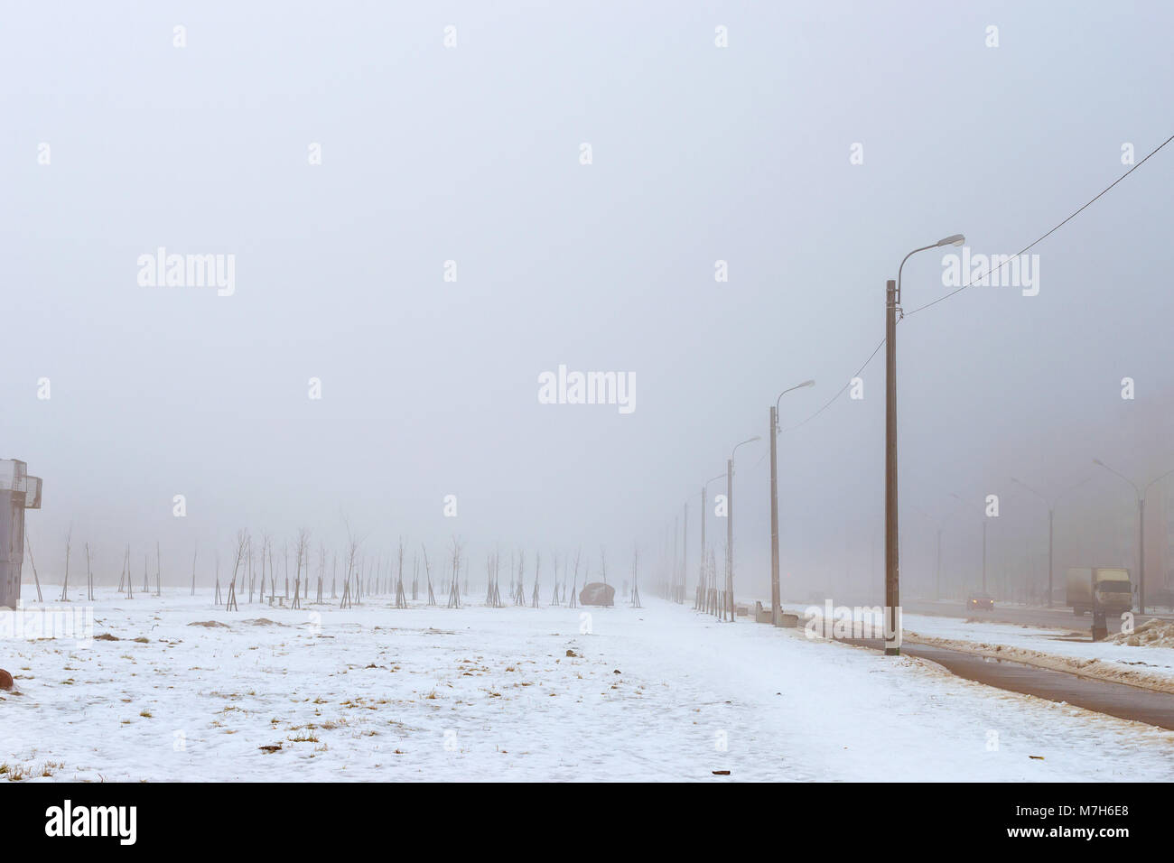 Thick fog early cloudy winter morning. Snowy landscape in the season of ...