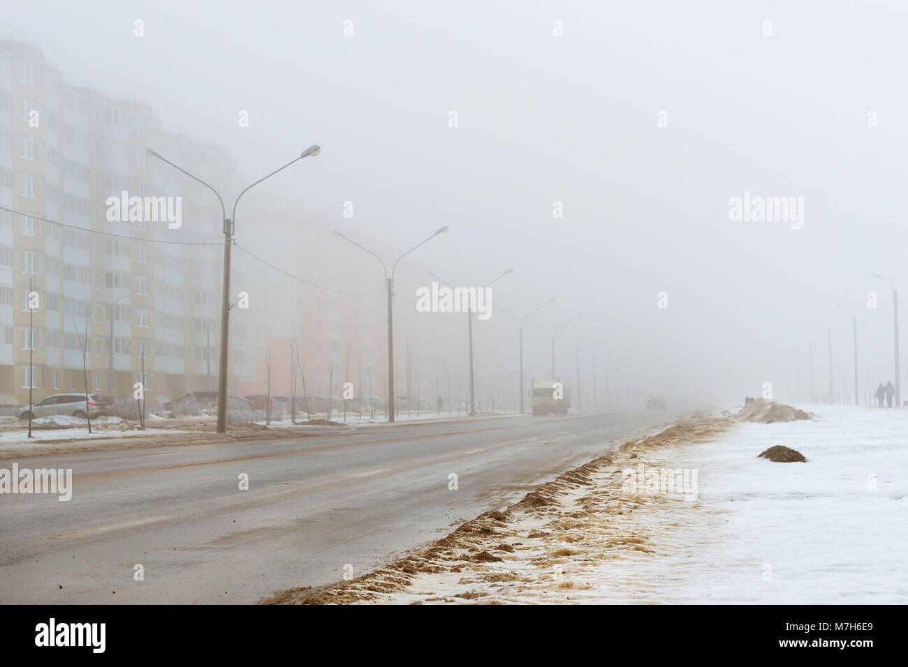 Thick fog early cloudy winter morning. Snowy landscape in the season of ...