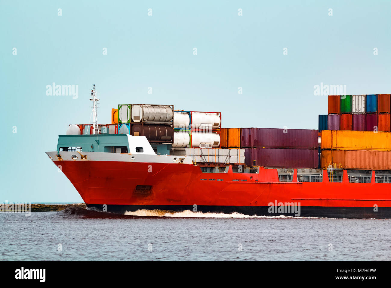Red container ship. Logistics and production export Stock Photo - Alamy