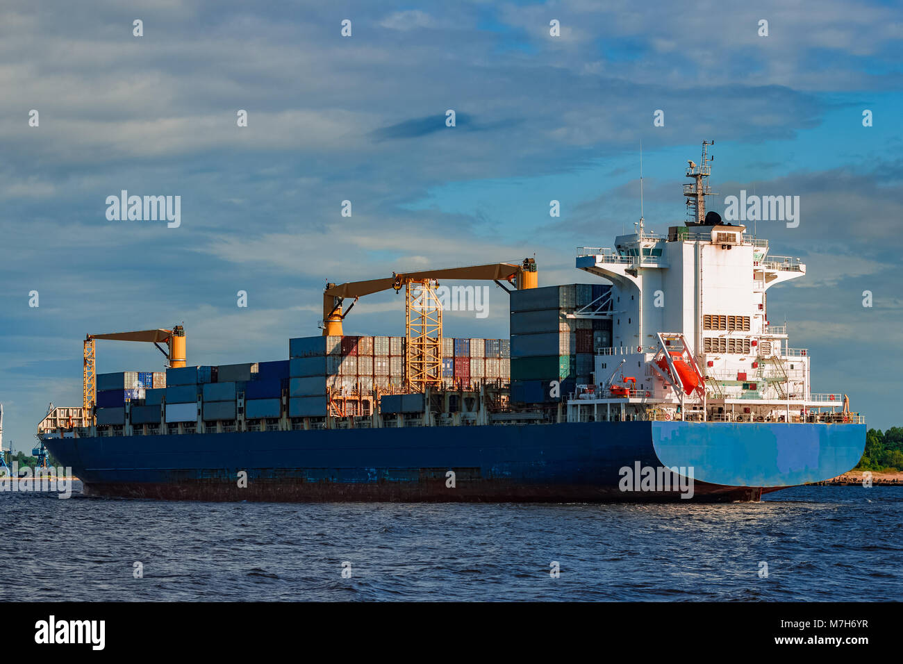 Blue container ship. World logistics and production transfer Stock ...