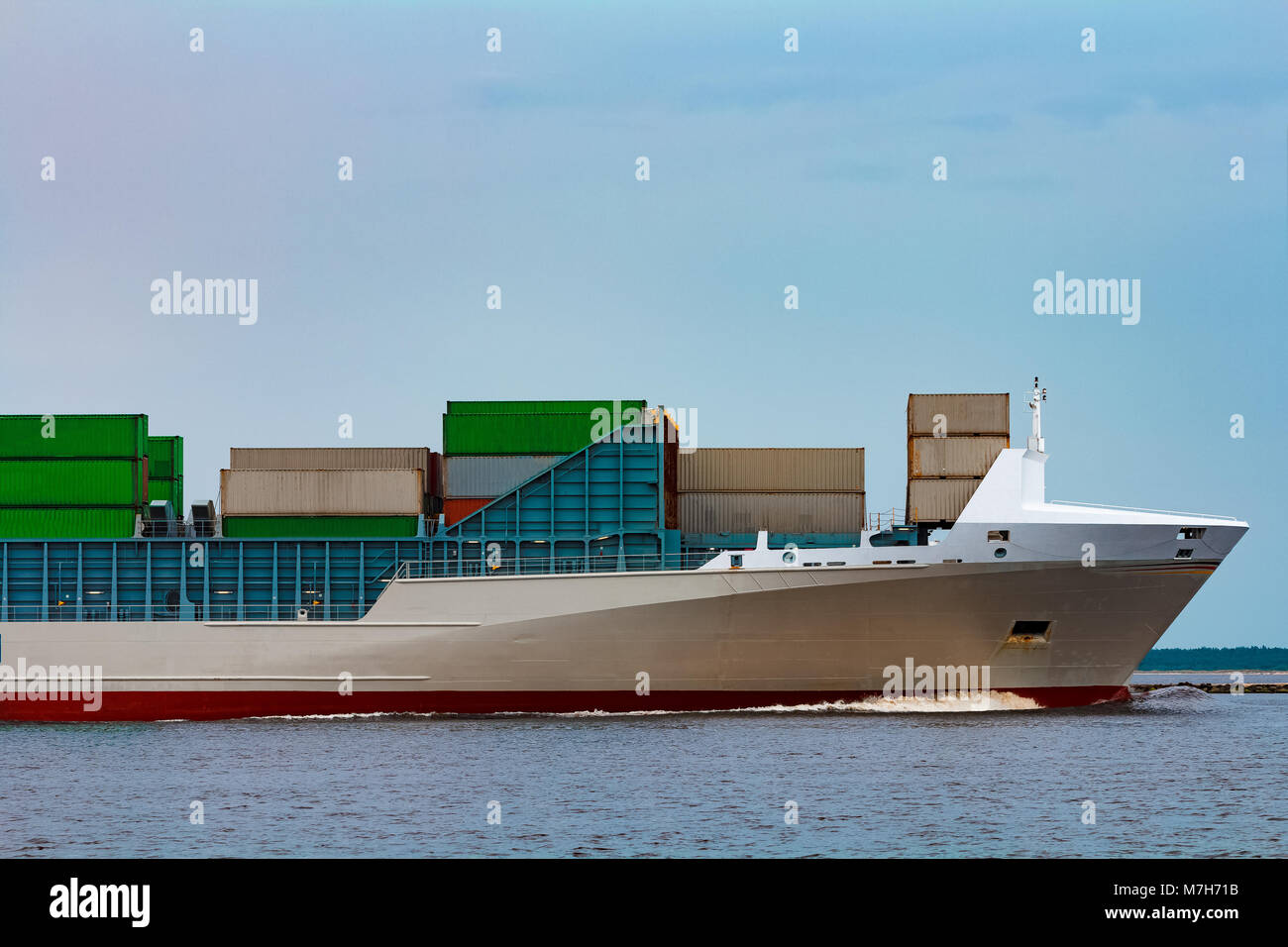 Grey container ship. Logistics and production import Stock Photo - Alamy