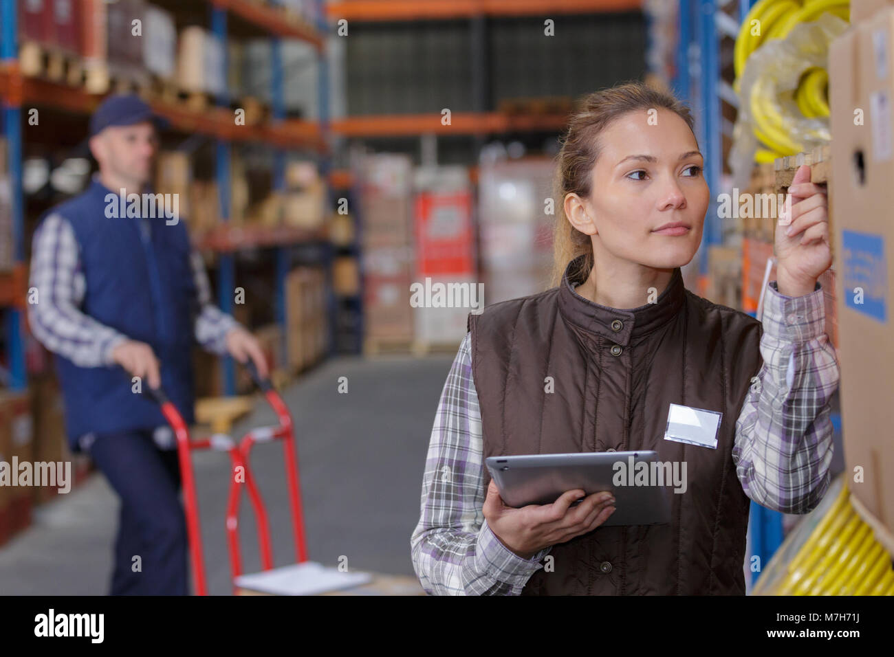 warehouse worker scanning box in warehouse Stock Photo - Alamy